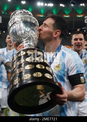 Argentina's Lionel Messi kisses the trophy after beating Brazil 1-0 in ...