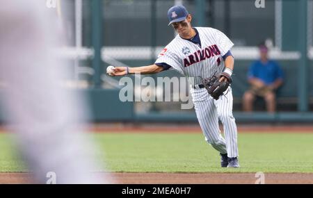 Arizona's Kobe Kato (1) fields a ball hit by Stanford's 44 in the first ...