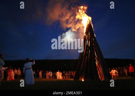 People wearing traditional Russian village-style clothes celebrate the ...