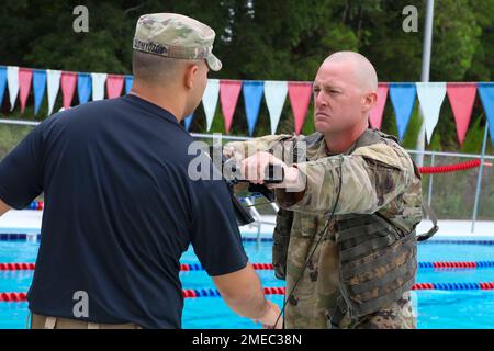 Paratroopers participate in a Combat Water Survival Assessment on the ...