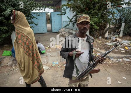 A fighter loyal to the Tigray People's Liberation Front (TPLF), center ...