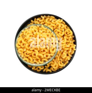 Plate of uncooked elbow pasta on white background Stock Photo - Alamy