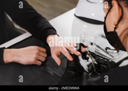 Manicure man close up to the beauty salon Stock Photo - Alamy