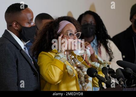 Marcia Carter-Patterson, the mother of Manuel "Manny" Ellis, listens to ...