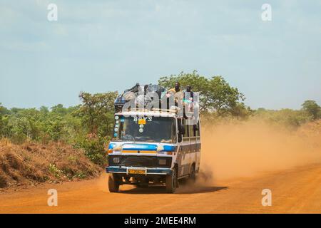 Crowded African Public Bus with the Bags on the Dusty Road in the heart ...