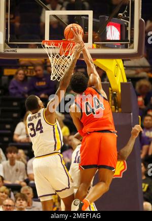 Auburn center Dylan Cardwell (44) saves the ball before going out of ...