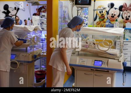 A Moroccan nurse takes care of one of the nine babies protected in an ...