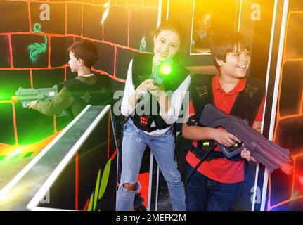 Kids playing laser tag on labyrinth Stock Photo - Alamy