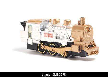 toy train with freight car trolley on railway tracks, isolated on white ...