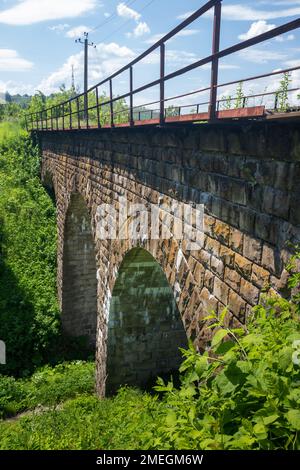 the old railway bridge is built of stone. historic building used Stock ...