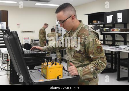 Airman 1st Class Jesus Denogean, a precision measurement equipment ...