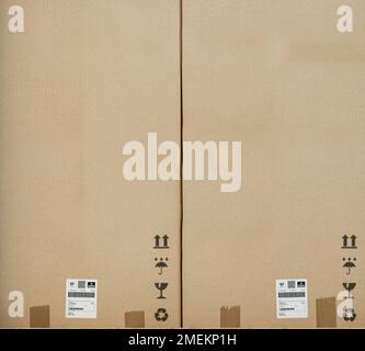 A flat view of a stack of cardboard boxes with logistics stickers o- 3D ...