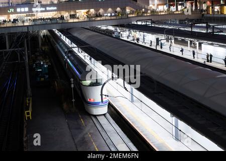 A JR East E353 Series Azusa express train and a local train on the Oito Line at Minami-Otari ...