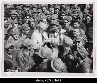 Former heavyweight champion Jack Dempsey poses with a photograph ...