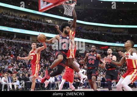 Chicago Bulls' Coby White (0) looks to pass during the first half of an ...
