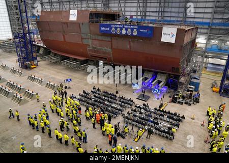 Workers look on at HMS Ventura in the Ventura building after a ceremony ...