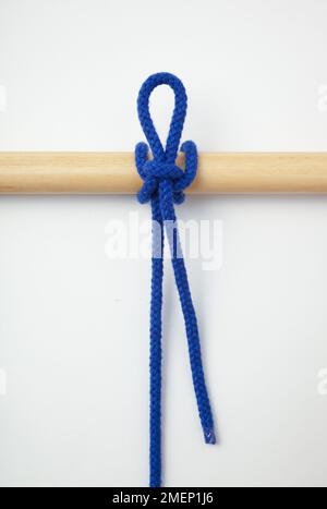 Rope knot Highwayman’s hitch tied around a pole. Rope knot Highwayman’s ...