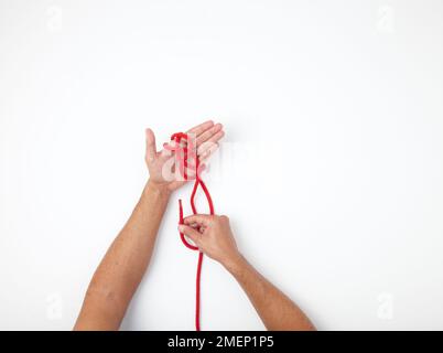 Turk's Head - Four-Lead Five-Bight, a decorative knot tied in red rope ...