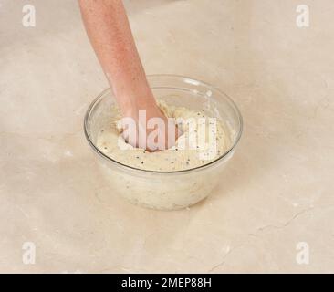 Knocking back dough (making bread rolls Stock Photo - Alamy