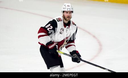 Arizona Coyotes defenseman Jordan Oesterle (82) is checked by Montreal ...