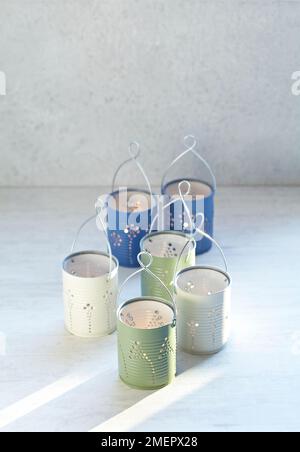 Tin can lanterns with wire handles, close-up Stock Photo - Alamy