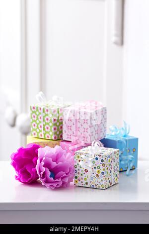 a stack of multi colored tissue paper spread out in a fan on a ...