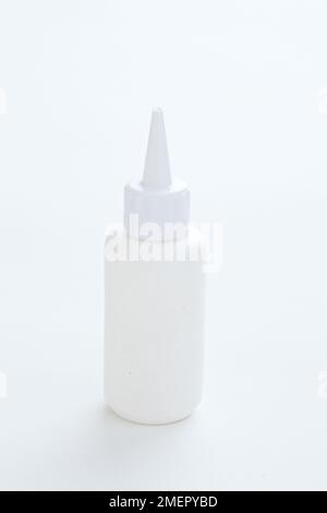 close-up of plastic glue bottle with cap, mock-up template with copy ...