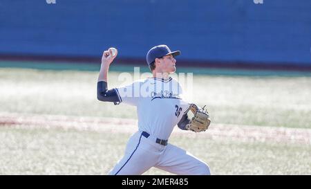 Oral Roberts pitcher Cade Denton (36) slaps hands with Dylan Wipperman ...