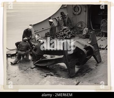 A Coast Guard Buoy Tender, LAUREL, demonstrates the process of planting ...