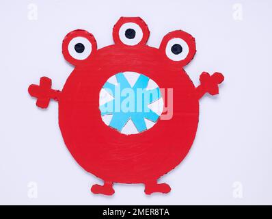Red painted cardboard cut out monster, making cardboard cut out monster ...