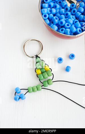 Making beaded lizard key ring Stock Photo - Alamy