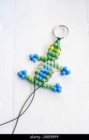 Making beaded lizard key ring Stock Photo - Alamy