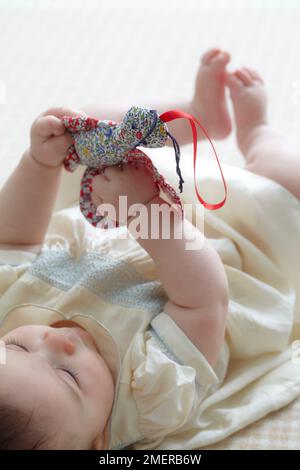 Close up of an Indian girl playing with toys Stock Photo - Alamy