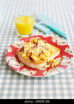 Scrambled eggs orange juice on a white wooden table Stock Photo - Alamy