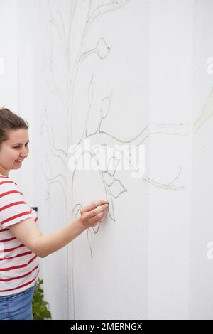 Drawing tree design on outer wall Stock Photo - Alamy
