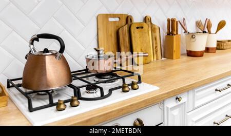 Teapot kitchen stove interior design Stock Photo - Alamy