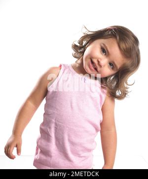 Girl standing wearing a pink vest, 20 months Stock Photo - Alamy