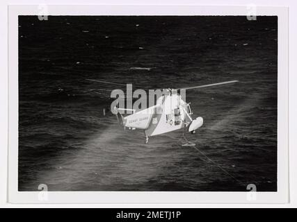A Coast Guard helicopter, piloted by Lieutenant Commander Roger Love ...