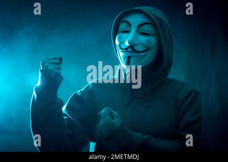 Hacker with anonymous mask with a making fight symbol, with a ...