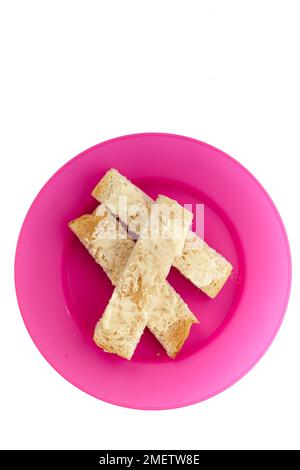Buttered toast cut into strips Stock Photo - Alamy