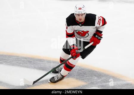 New Jersey Devils' Michael McLeod (20) reaches for the puck next to New ...