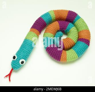 Knitted toy snakes Stock Photo - Alamy