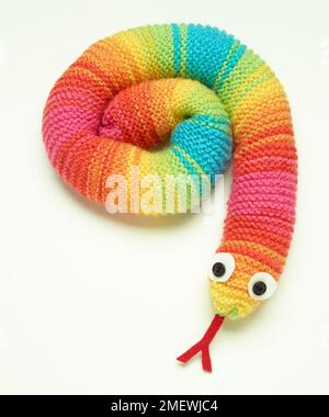 Steps to making snake in self-striped yarn Stock Photo - Alamy