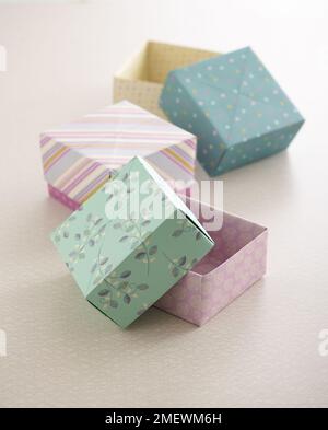 Paper Craft. DIY Origami Gift box Step 5 Stock Photo - Alamy