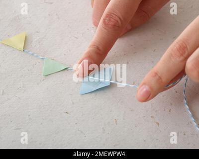 Papercraft. Paper bunting step 3. Attaching paper piece to bunting ...