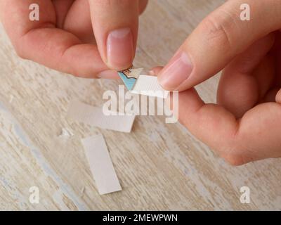 Papercraft. DIY Photo corners step 1. Fold corners of paper diagonally ...