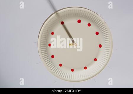 Creating a homemade sundial with a pencil and a paper plate Stock Photo ...