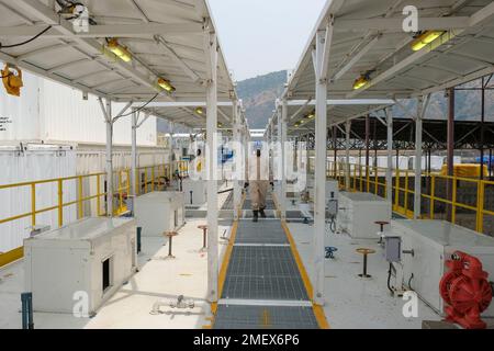 A Ugandan worker from China Oilfield Services Limited (COSL), a ...