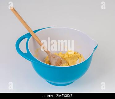 Step by step. Mixing ingredients in a mixing bowl to make zucchini ...
