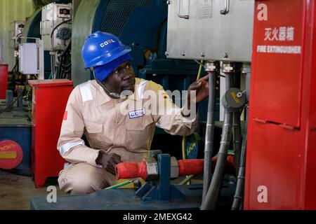 A Ugandan worker from China Oilfield Services Limited (COSL), a ...